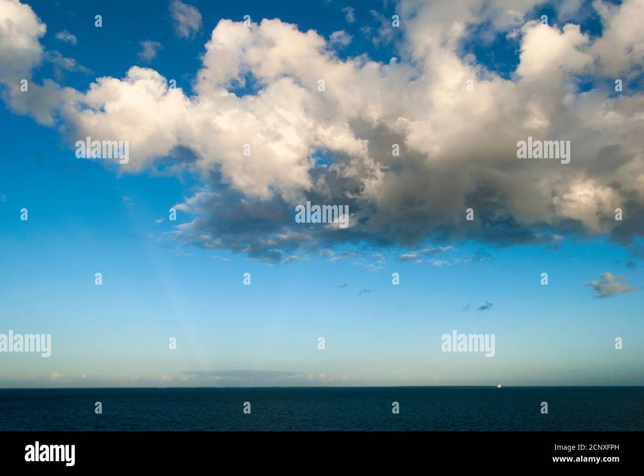 The late afternoon cloud view with a cruise ship in a background ...