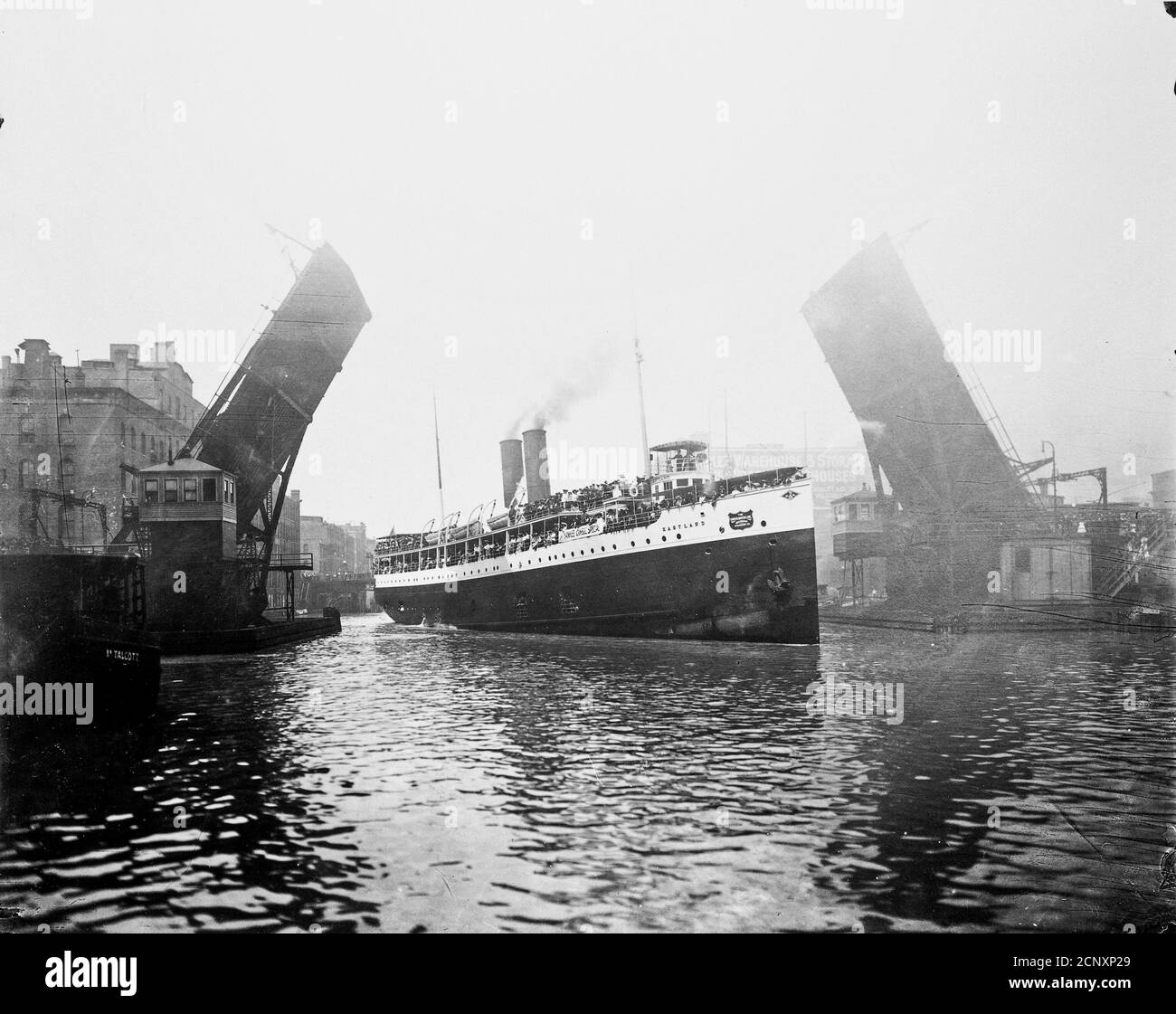 View of the Eastland ship passing under the State Street Bridge ...
