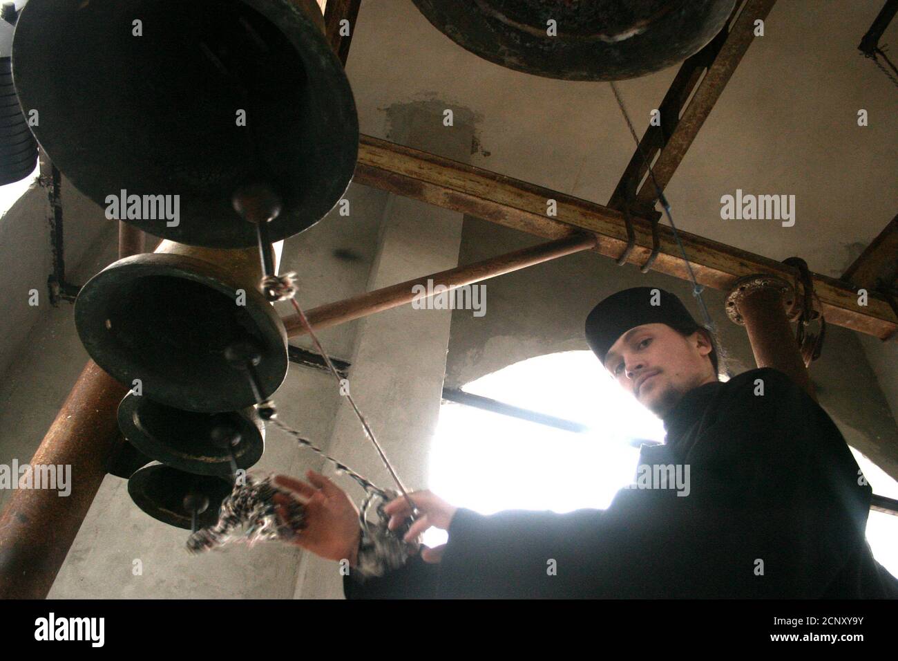 Monks ringing the bells at a Christian Orthodox Monastery in Romania ...