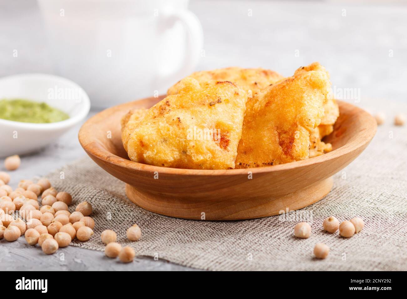 traditional indian food paneer pakora in wooden plate with mint chutney ...