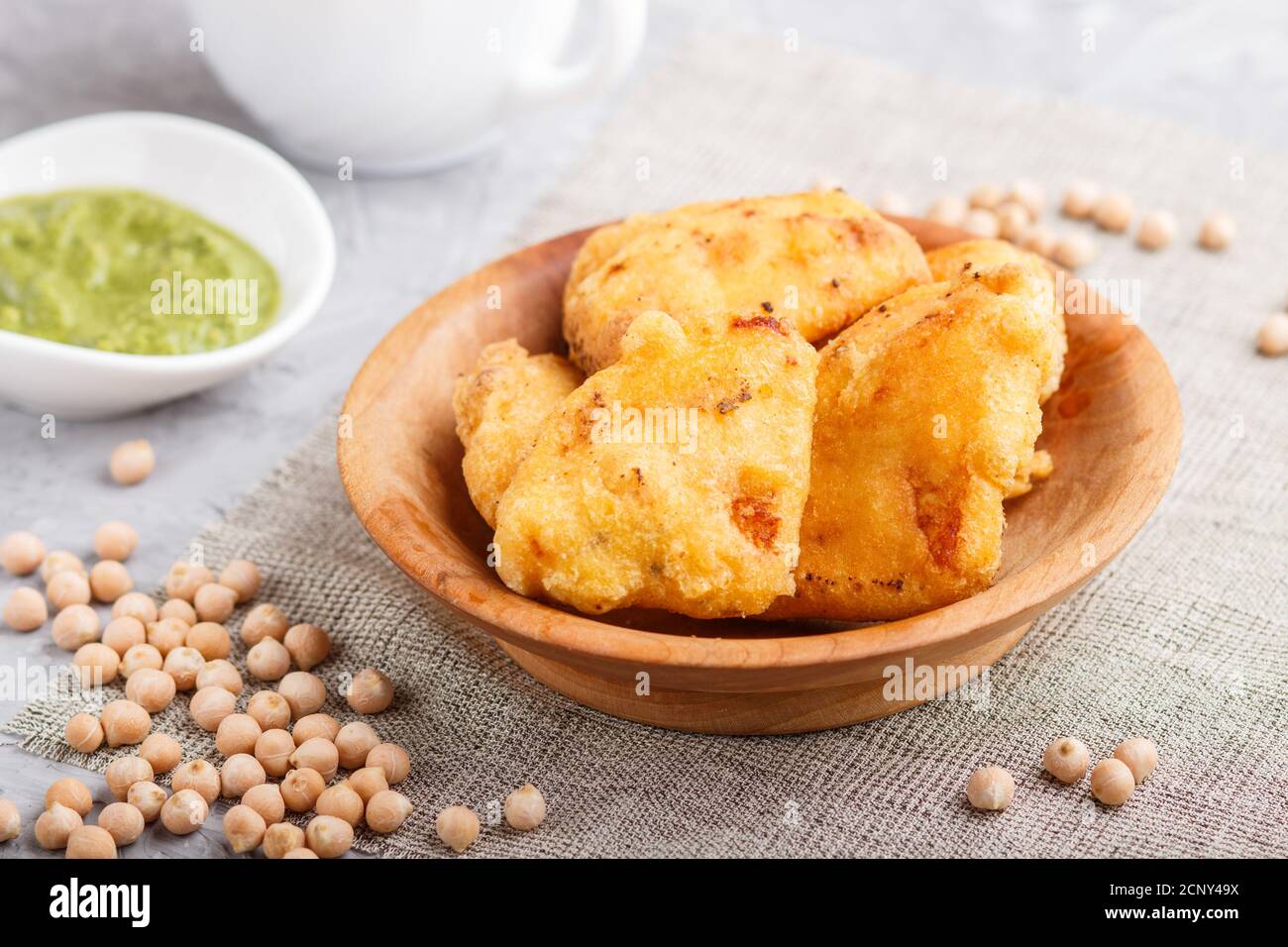 traditional indian food paneer pakora in wooden plate with mint chutney ...