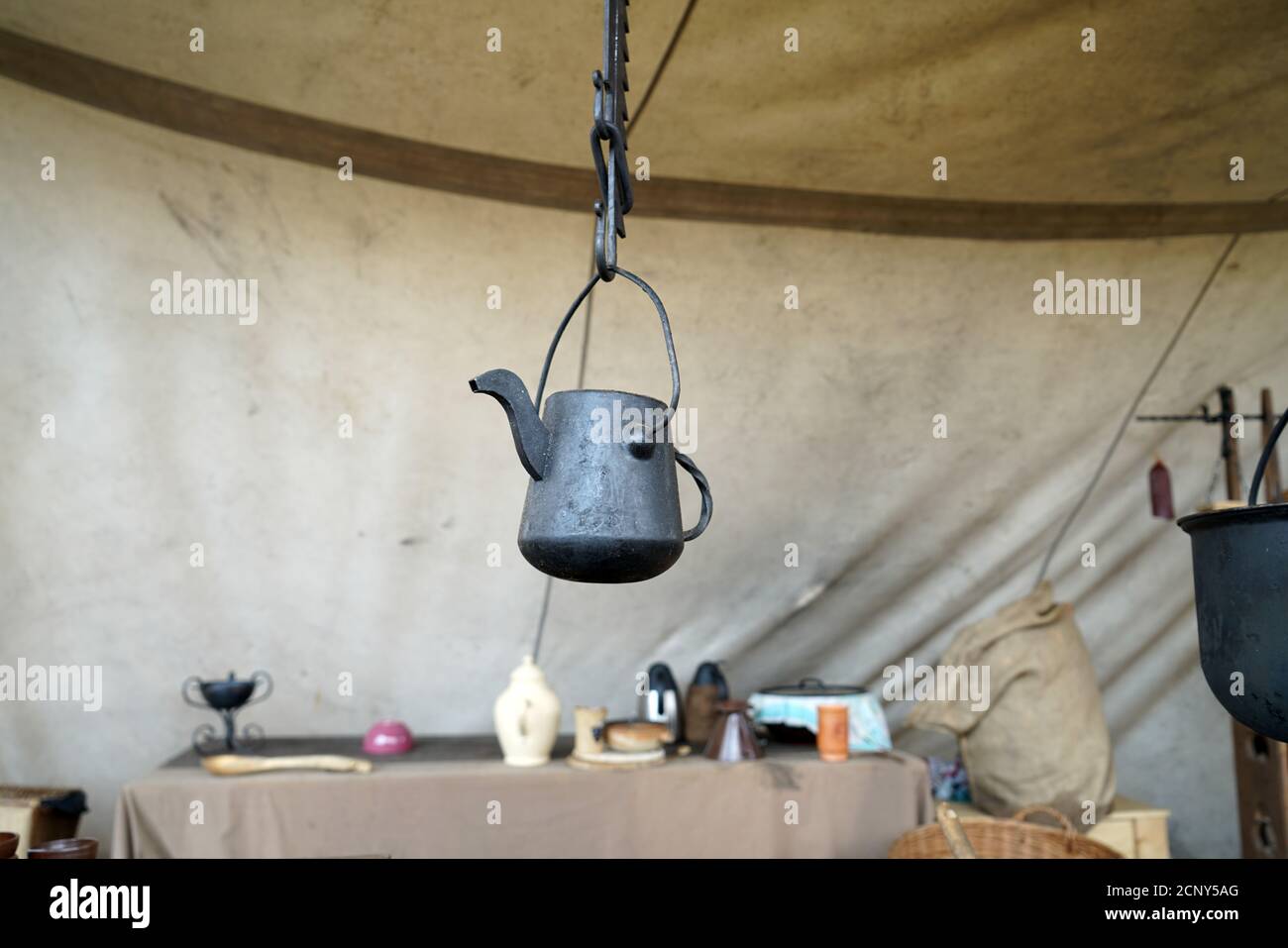Vintage metal kettle hanging in a market Stock Photo - Alamy
