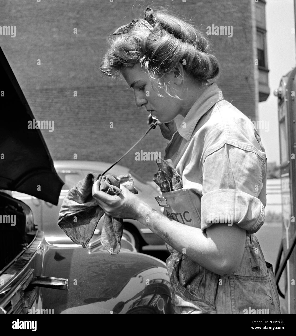 Checking oil with dipstick Black and White Stock Photos & Images - Alamy