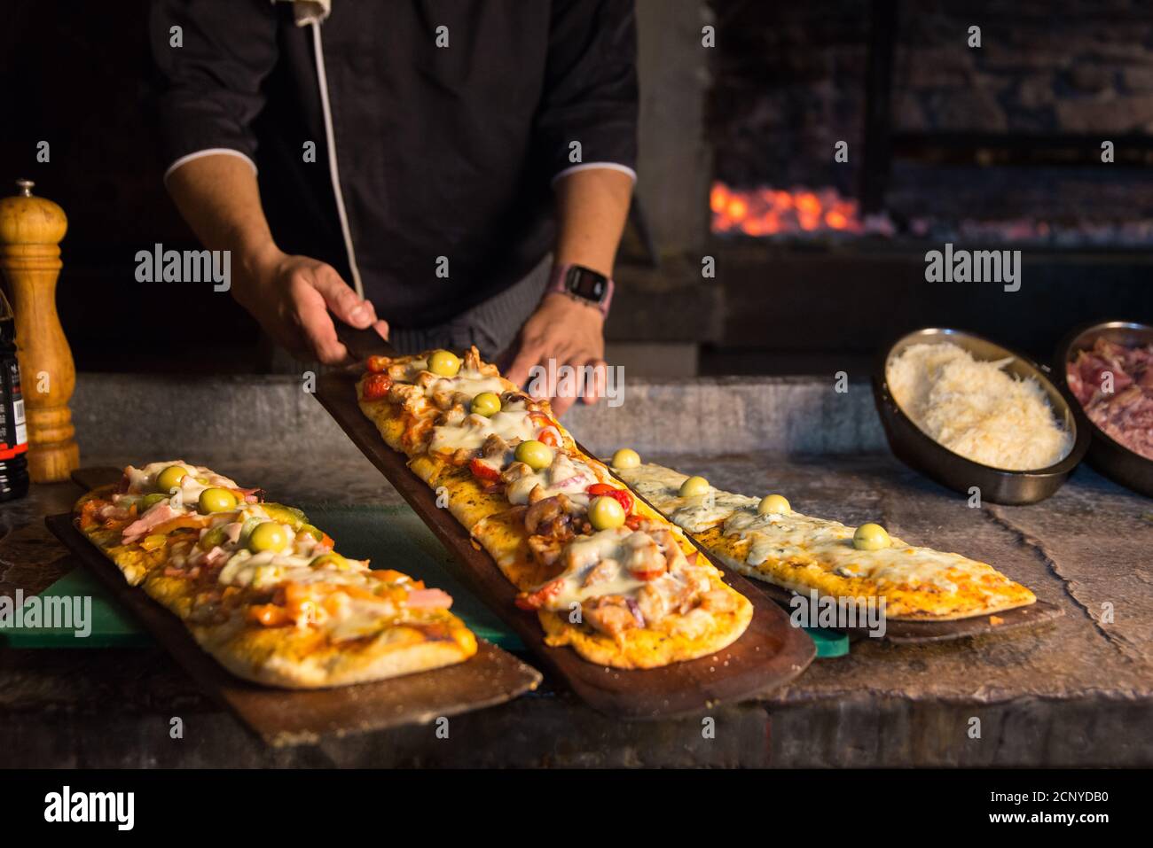 Rustic pizza cooked on grill for dinner Stock Photo - Alamy