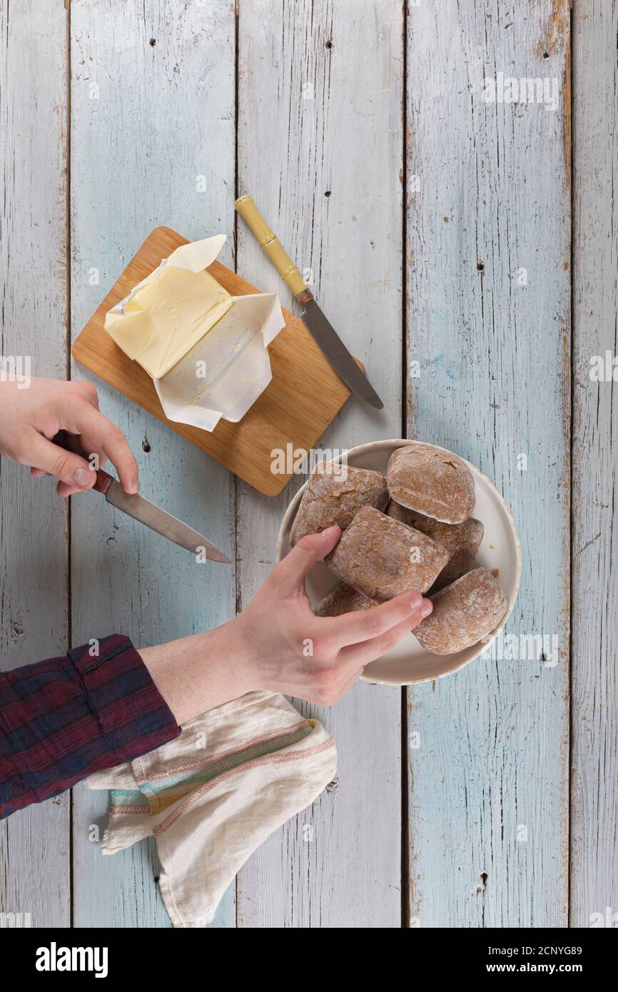 Man buttering bread hi-res stock photography and images - Alamy