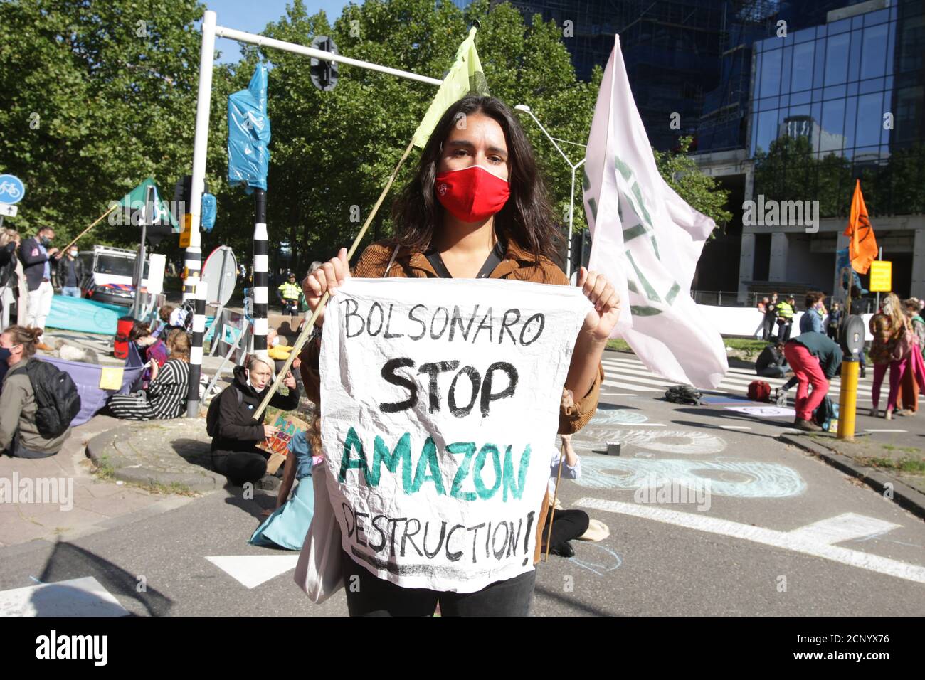 An Extinction Rebellion activist hold a banner ‘Bolsonaro Stop Amazon ...