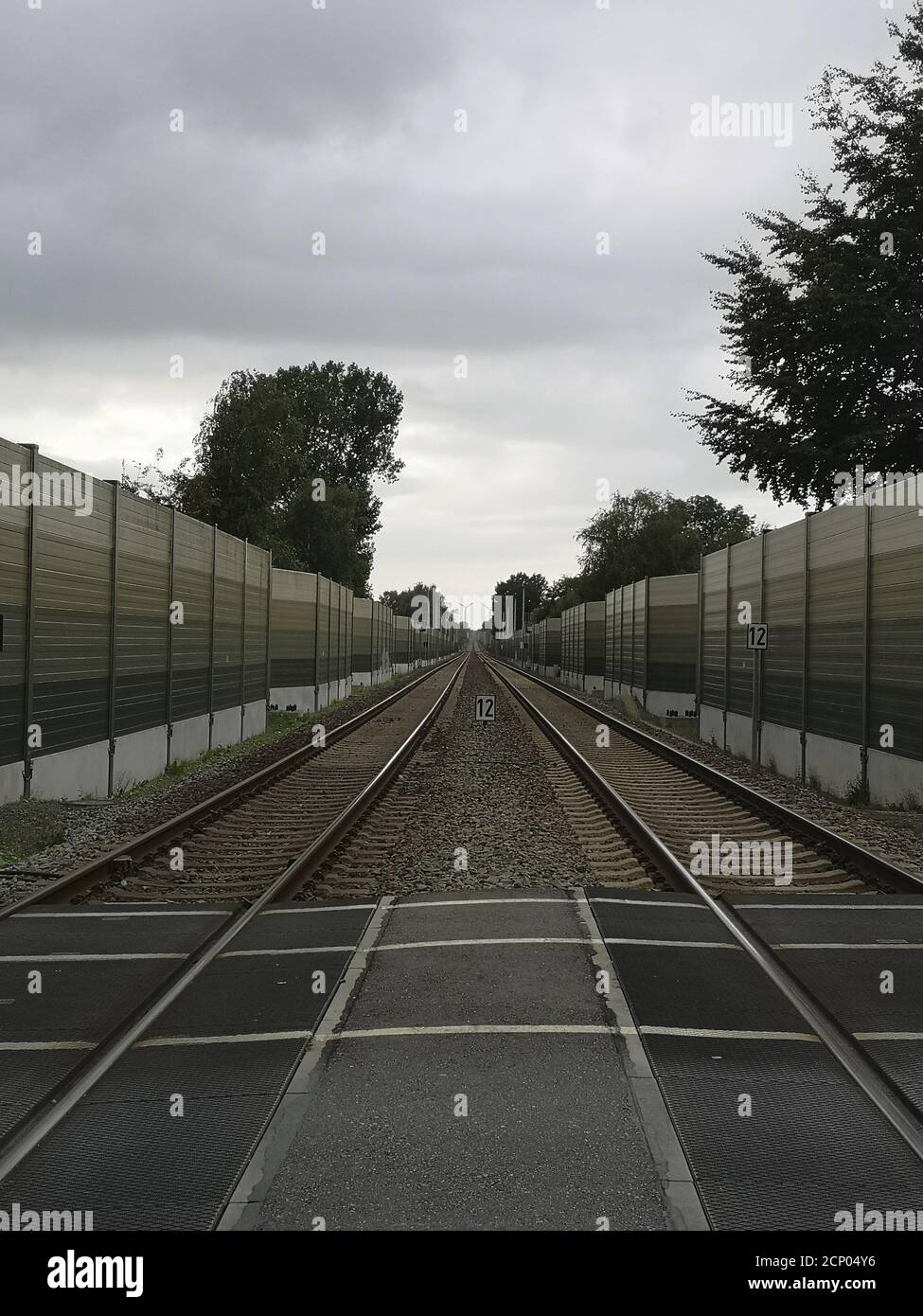 Vertical shot of a railroad crossing in Varel, Germany Stock Photo - Alamy