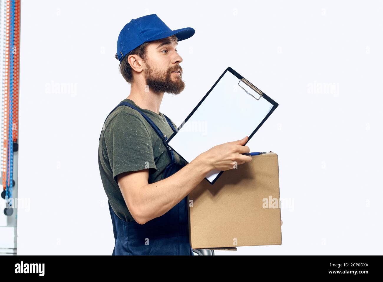 Working male courier with box in hand documents delivery service light ...