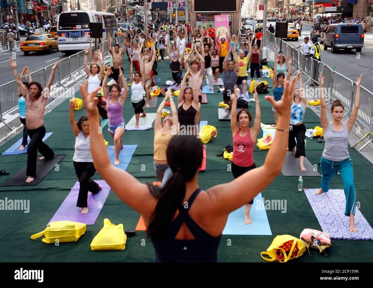 Summer solstice yoga times square hi-res stock photography and images ...