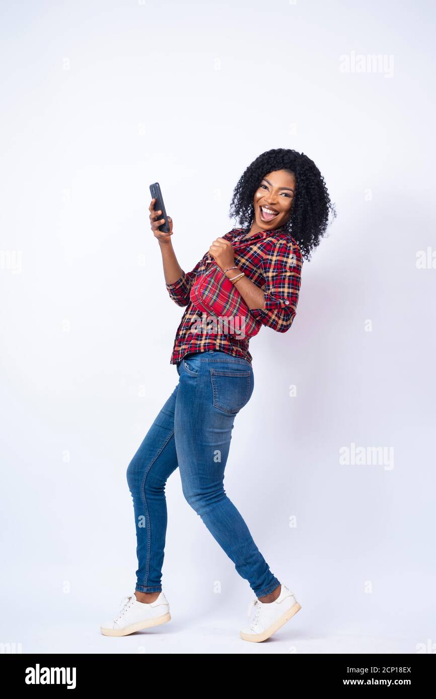 Black lady walking hi-res stock photography and images - Alamy