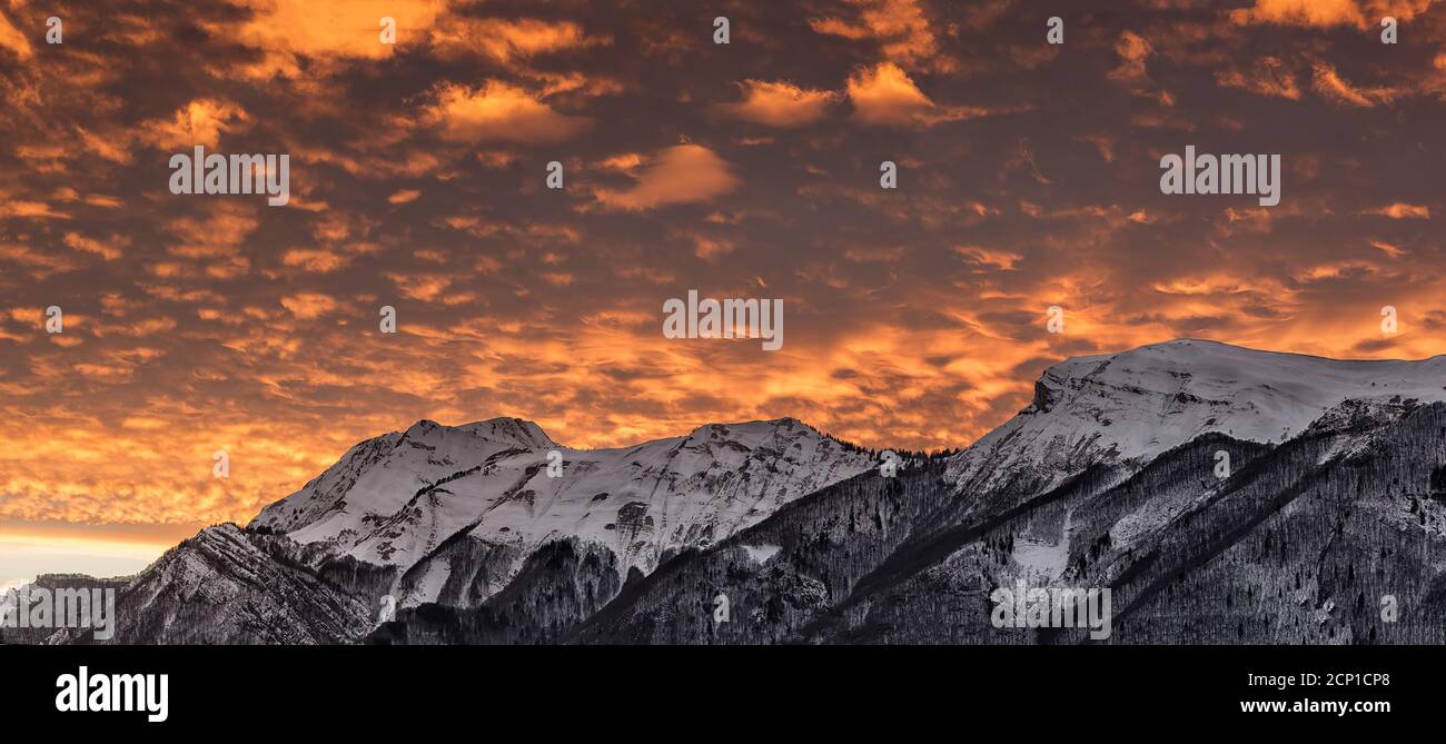 Sunset with mountains covered in snow in the French Alps Stock Photo ...