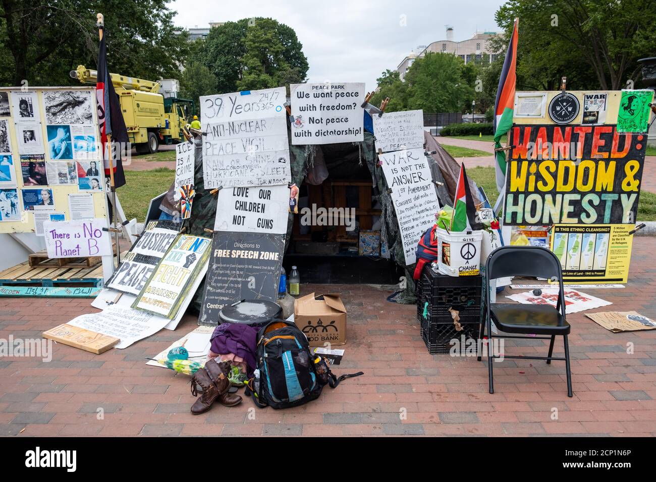 A tent with various protest signs in front of the White House on the ...