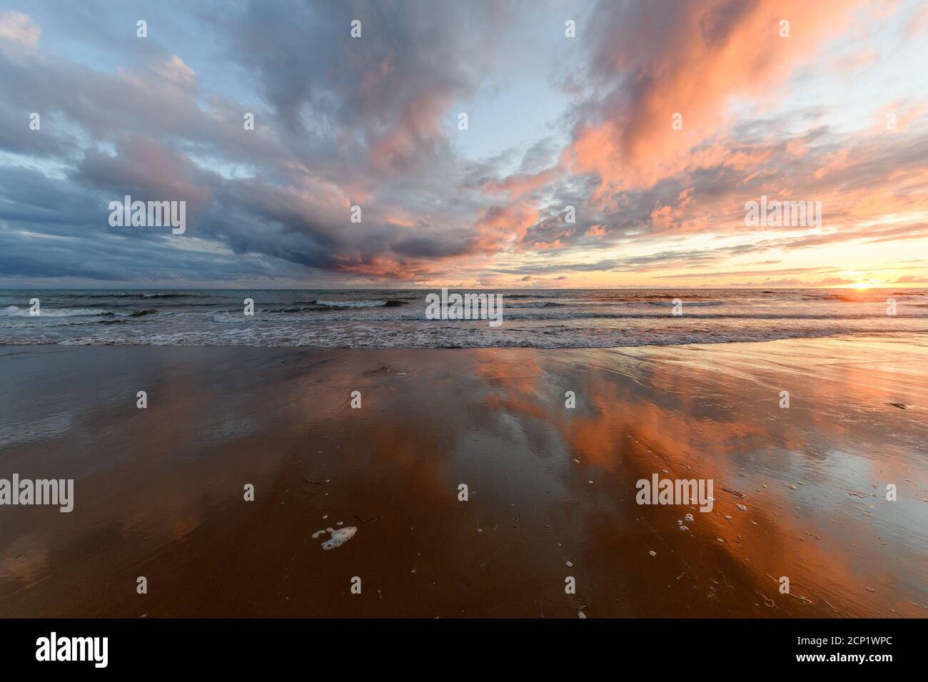 Sunset at the atlantic Ocean with orange beach and sky in France Stock ...