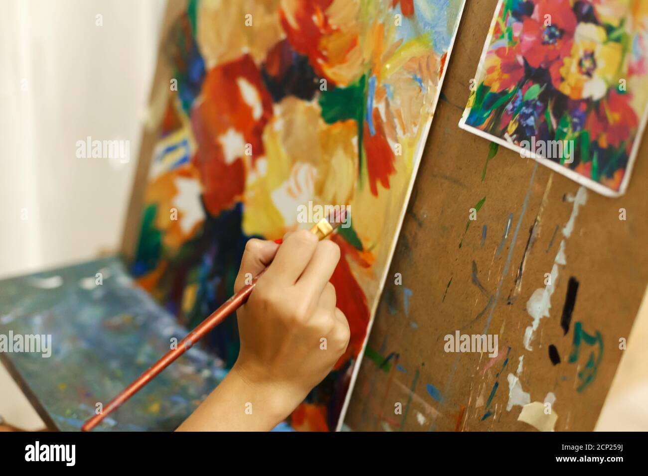 Close-up artist paints a picture on canvas with oil paints Stock Photo ...