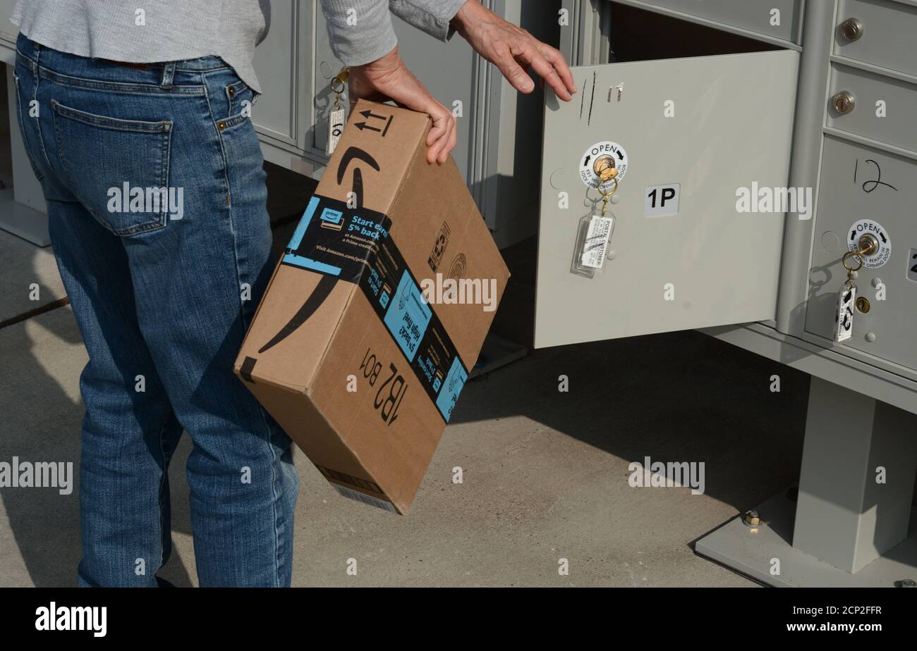 Mailman package hi-res stock photography and images - Alamy