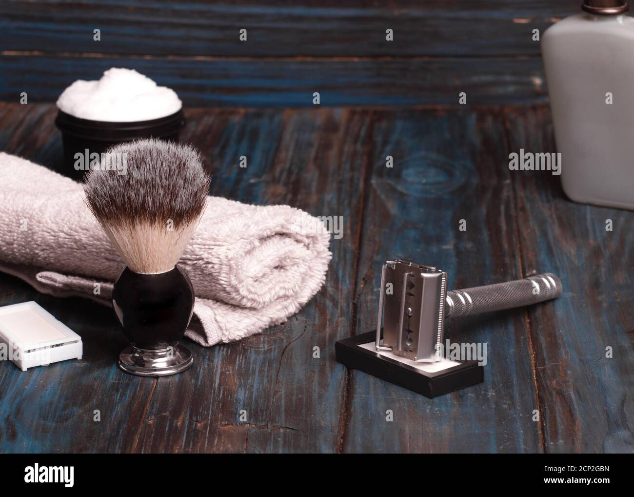 Razors, brush, balsam and foam on a wood background Stock Photo - Alamy