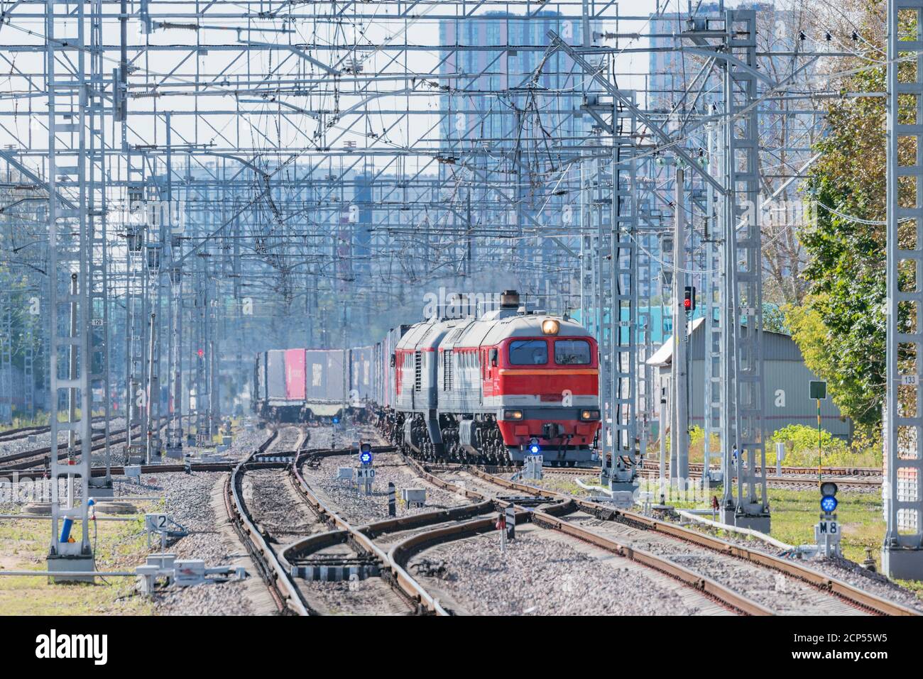 Diesel container freight train moves to the station Stock Photo - Alamy