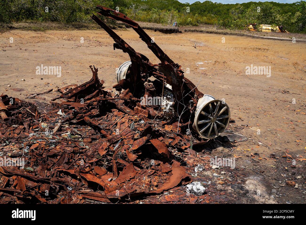 The rusted remains of the chassis of a burnt out car left abandoned and ...