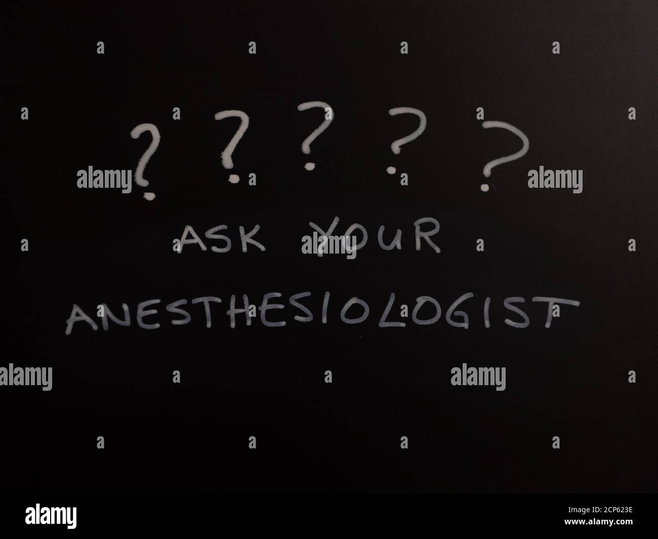 Ask your anesthesiologist written on chalkboard with question marks ...