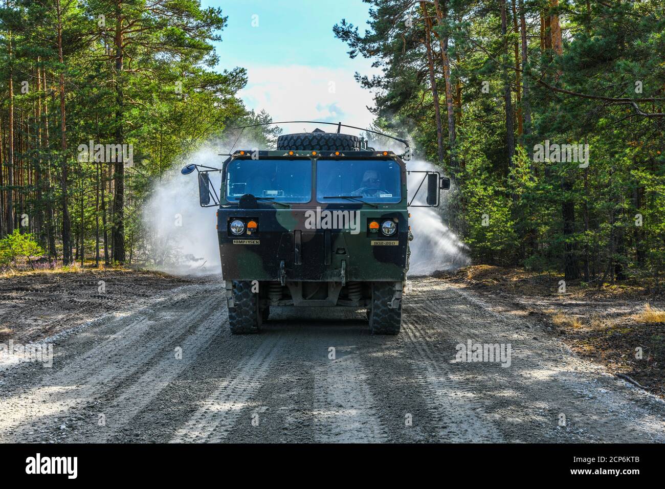 U.S. Army Soldiers with the 15th Engineer Battalion spray water along ...