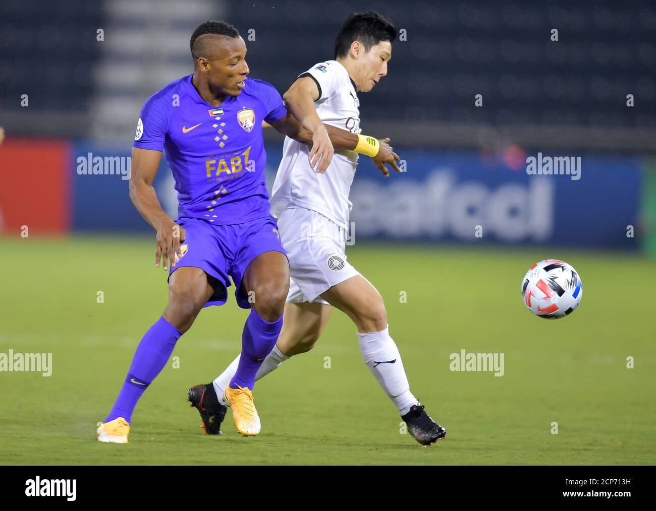 Doha, Capital of Qatar. 18th Sep, 2020. Nam Tae-hee (R) of Al Sadd vies ...