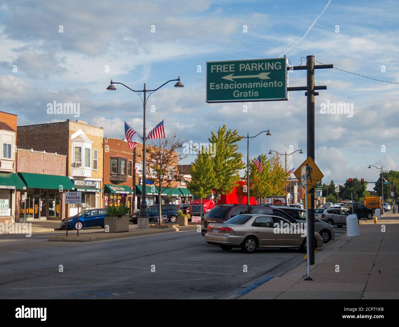 Bilingual English/Spanish sign directing to free parking. Downtown ...