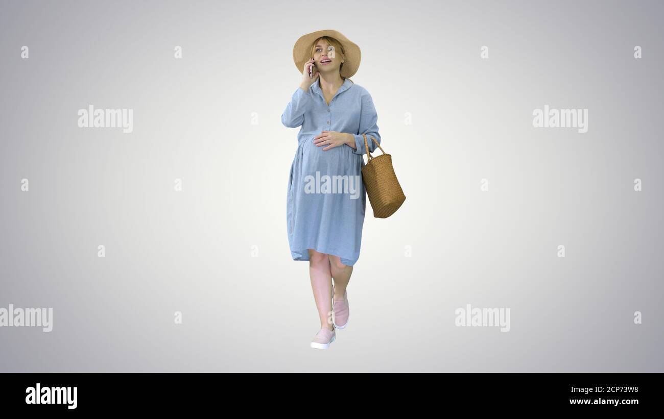 Beautiful caucasian pregnant woman making a call on summer walk Stock ...