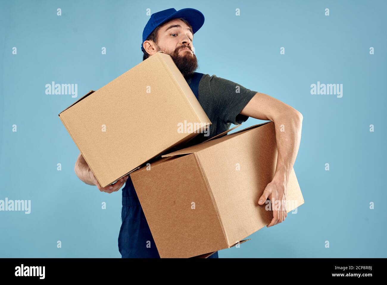 working man boxes in hands delivery service packaging lifestyle blue ...