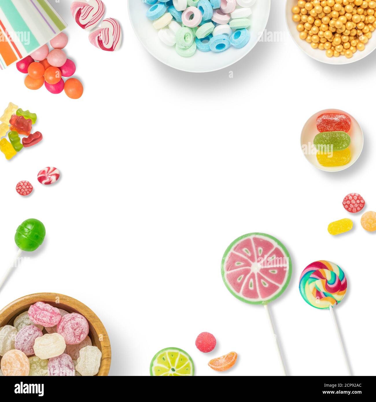 Candies, chocolates and lollipops on a white background with copy space ...