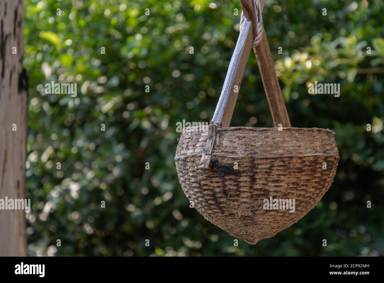 Ancient wooden water scoop for scooping water. At time of scooping the ...