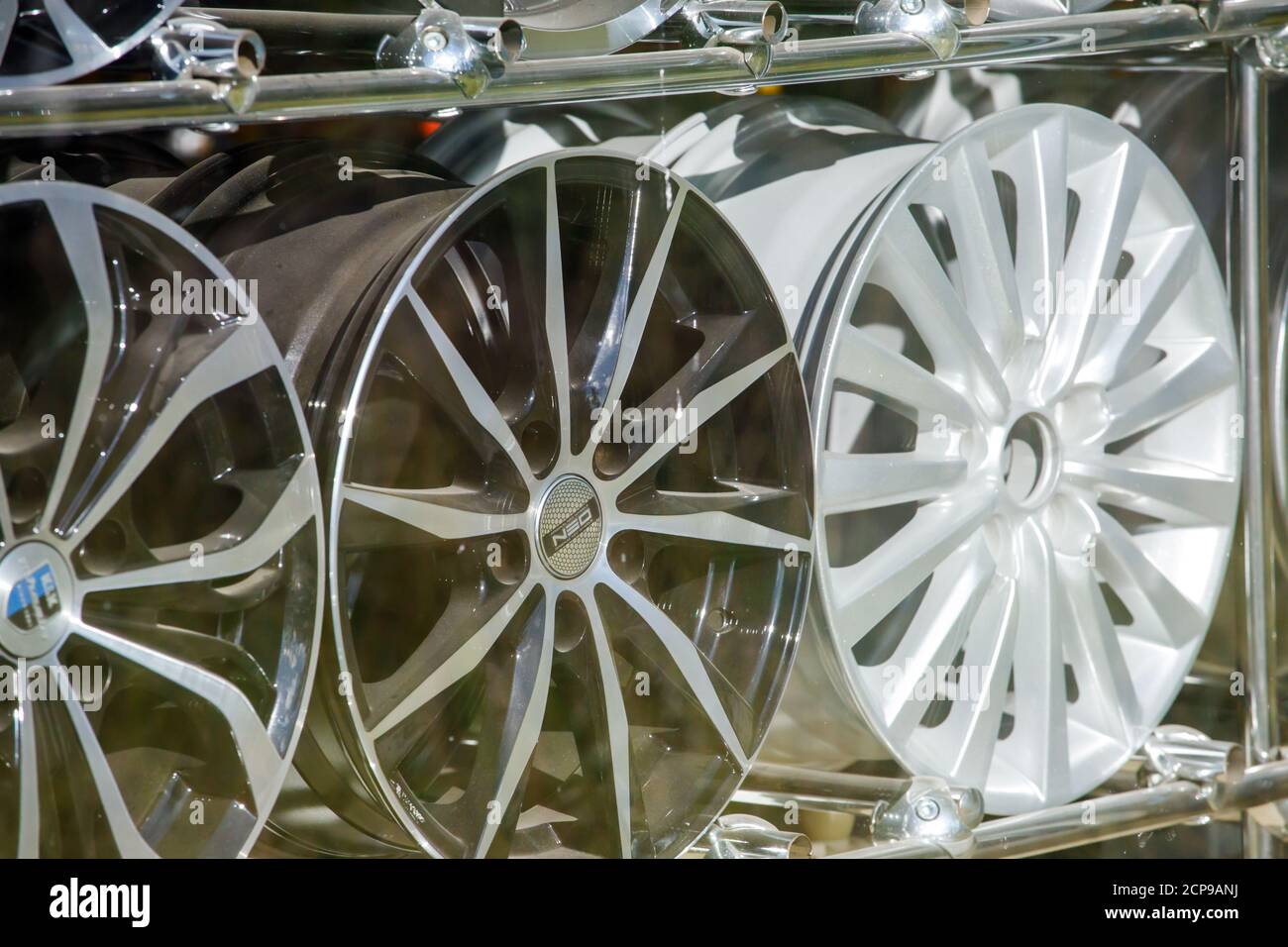 Russia Vyborg. 09.09.2020 Car rims in the shop window behind the glass ...
