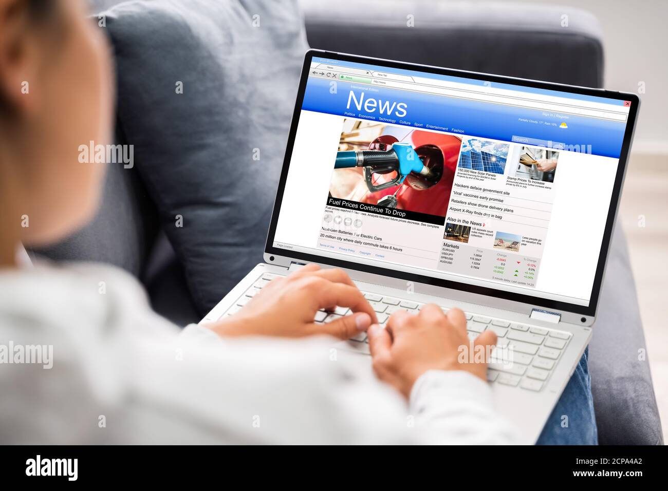 Watching News On Laptop Computer Screen Online At Home Stock Photo - Alamy