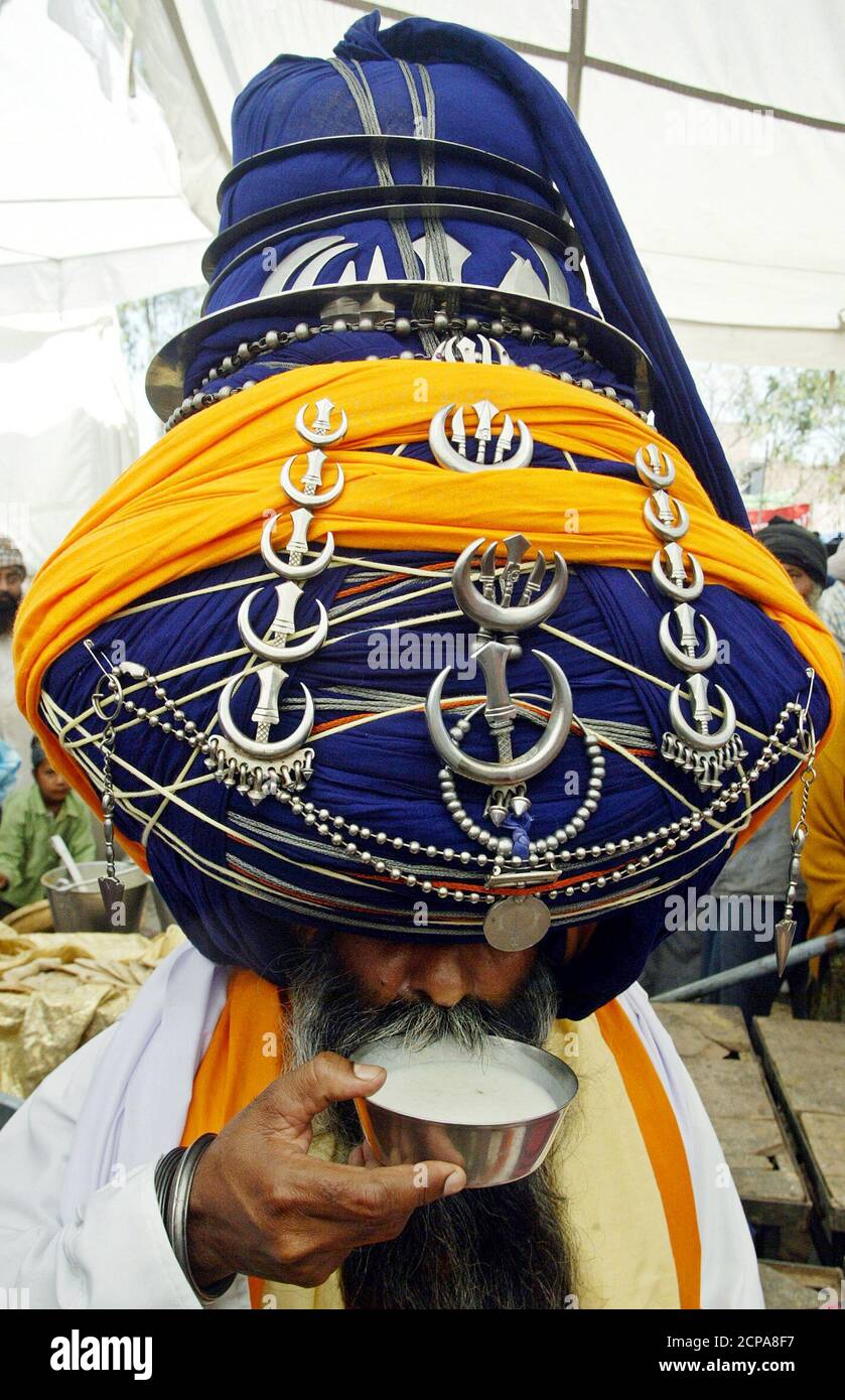 Sikh warrior wearing a traditional turban hi-res stock photography and ...