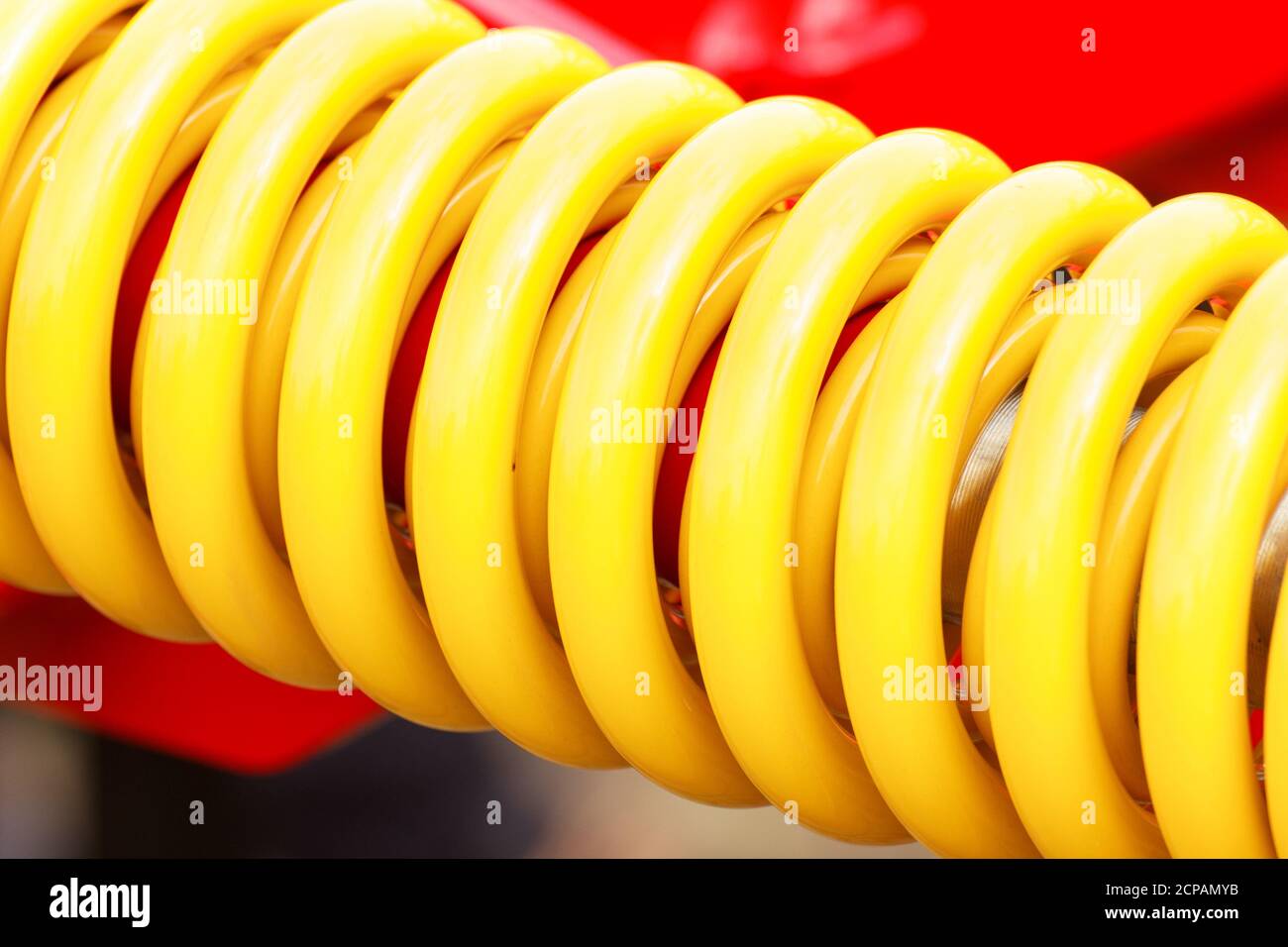 Steel spring as detail of industrial machinery, part of hydraulic or ...