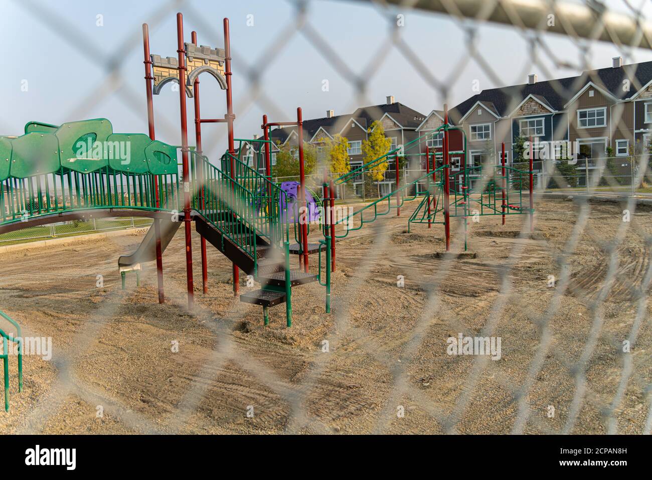 Childrend playground under construction behind a fence Stock Photo - Alamy