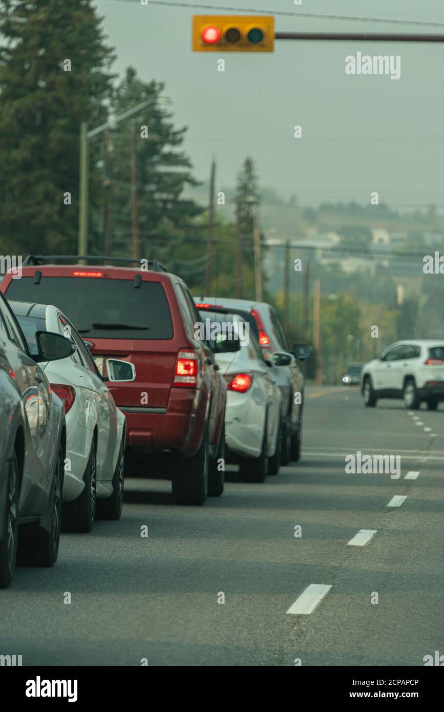 Cars in Traffic waiting for light at city intersection Stock Photo - Alamy