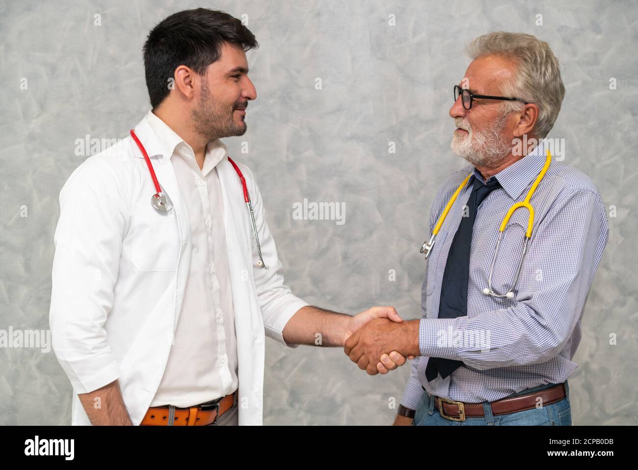 Happy doctor handshake nurse hi-res stock photography and images - Alamy