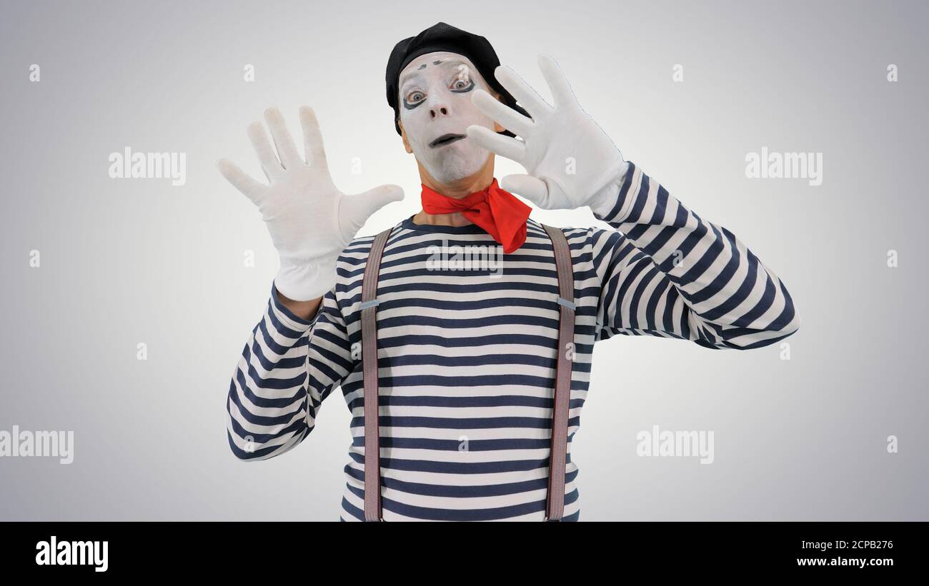 Mime holding touching imaginary wall and making imaginary bird o Stock ...