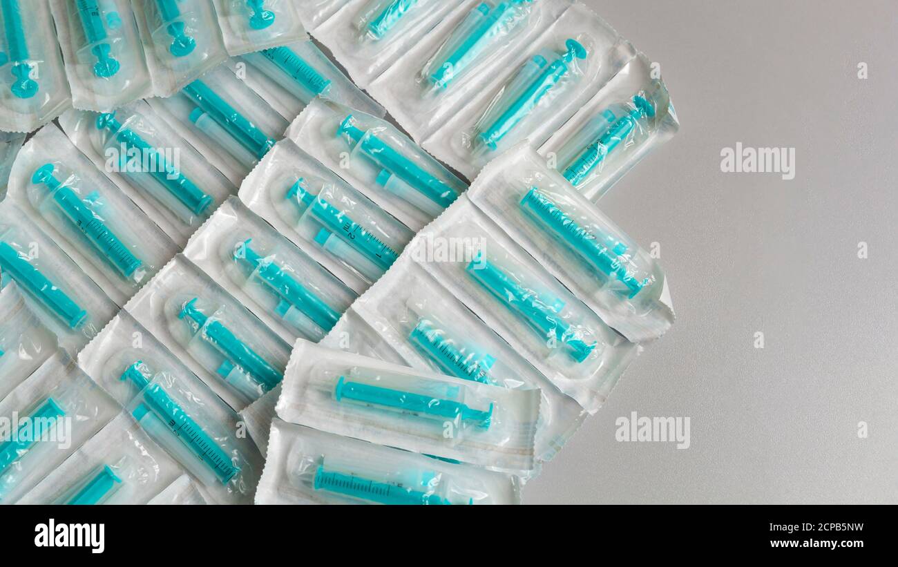 Medical syringes in a package. A bunch of unused, packaged syringes ...