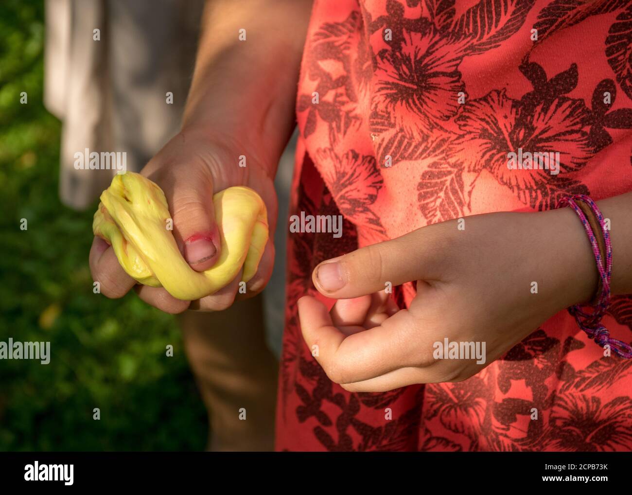 children's hands with self-made slime, slime making at a birthday party ...