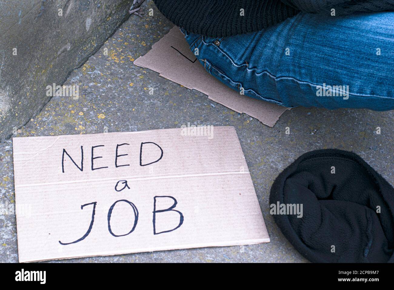 concept unemployment, poverty, job search, next to an unemployed person ...