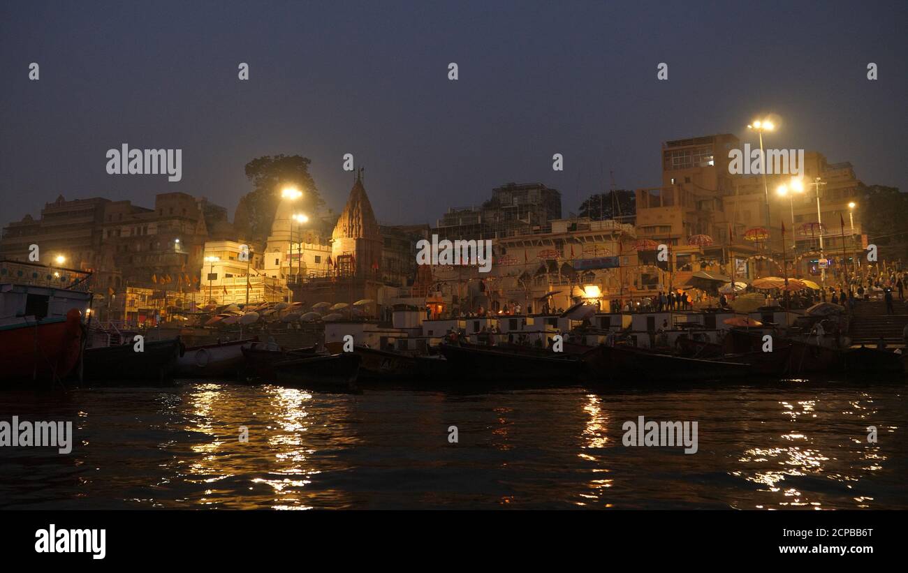 View of buildings of temples with ancient architecture of Varanasi ...