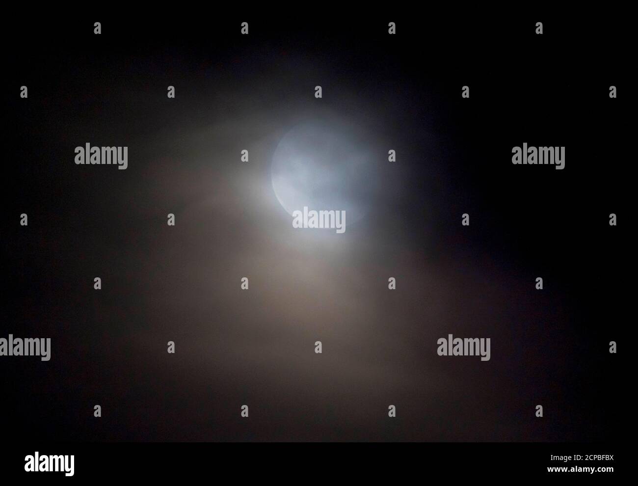 Cloudy moonlit night sky hi-res stock photography and images - Alamy