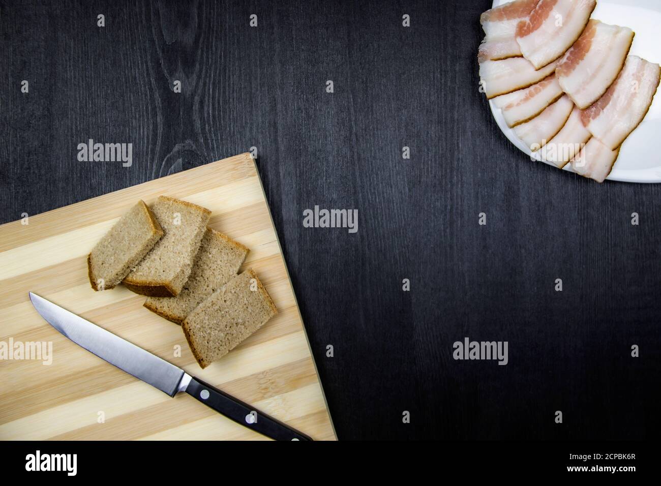 Ukrainian traditional meal. Slices of bread with kitchen knife and ...