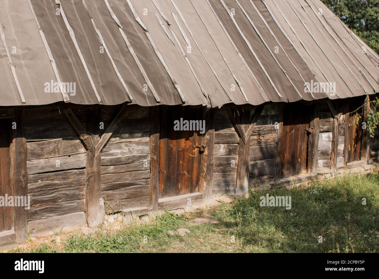 an old wooden barn among the trees Stock Photo - Alamy