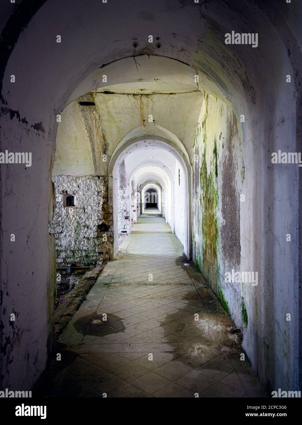 Corridor connecting the military fort in a state of neglect, walls ...