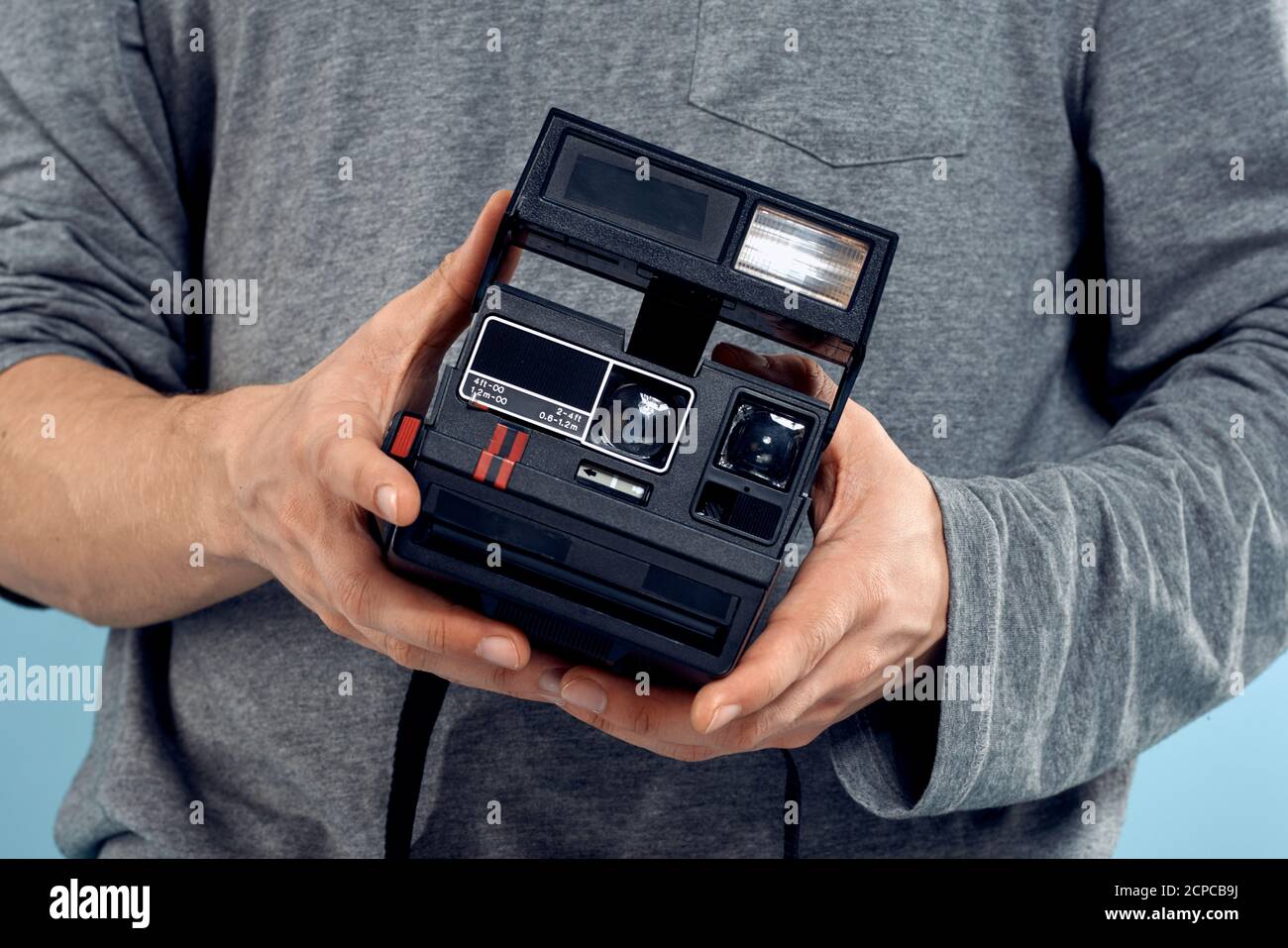 Photo camera in the hands of a man professional shooting lens ...