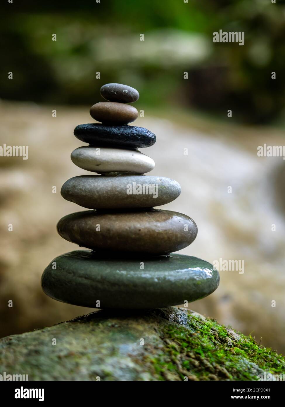 Balanced Zen stones pebbles at the waterfalls Stock Photo - Alamy