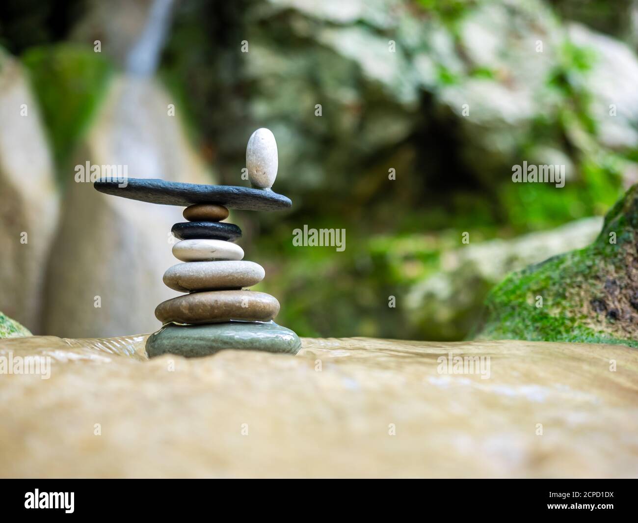 Balanced Zen stones pebbles at the waterfalls Stock Photo - Alamy