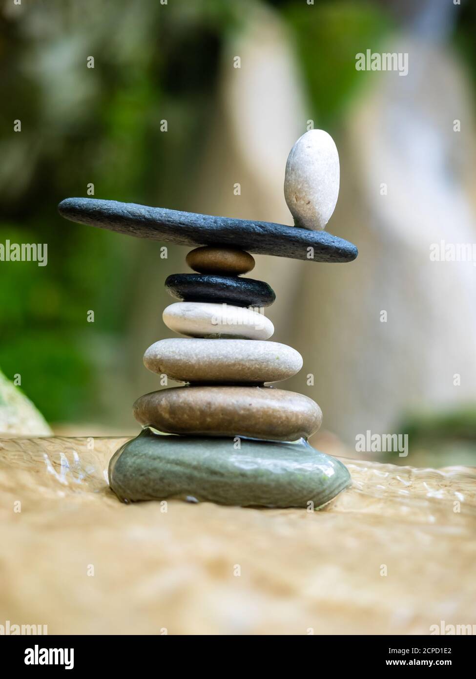 Balanced Zen stones pebbles at the waterfalls Stock Photo - Alamy
